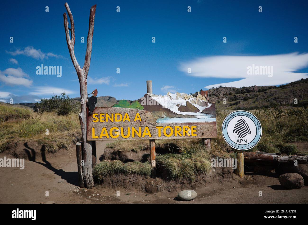 Sign board with inscription Senda a Laguna Torre means Path to Lake ...