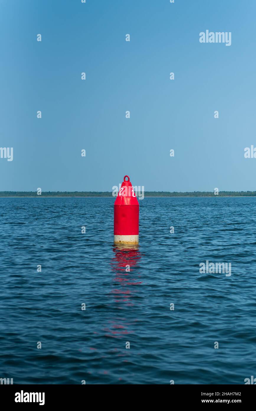 A red channel marker guides boats as they navigate waterway Stock Photo ...