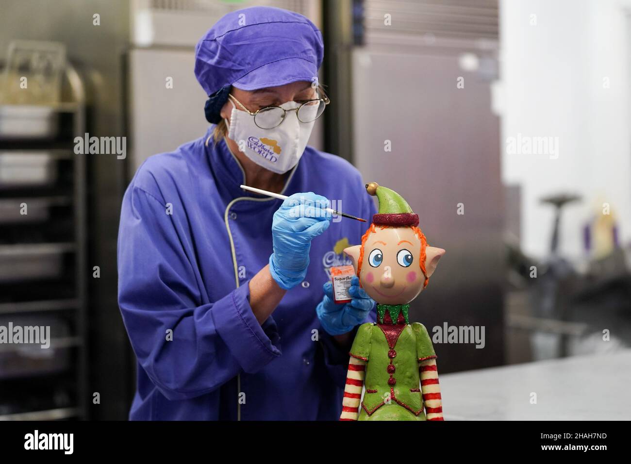 Chocolatier Dawn Jenks adds the finishing touches to the Christmas elf ...