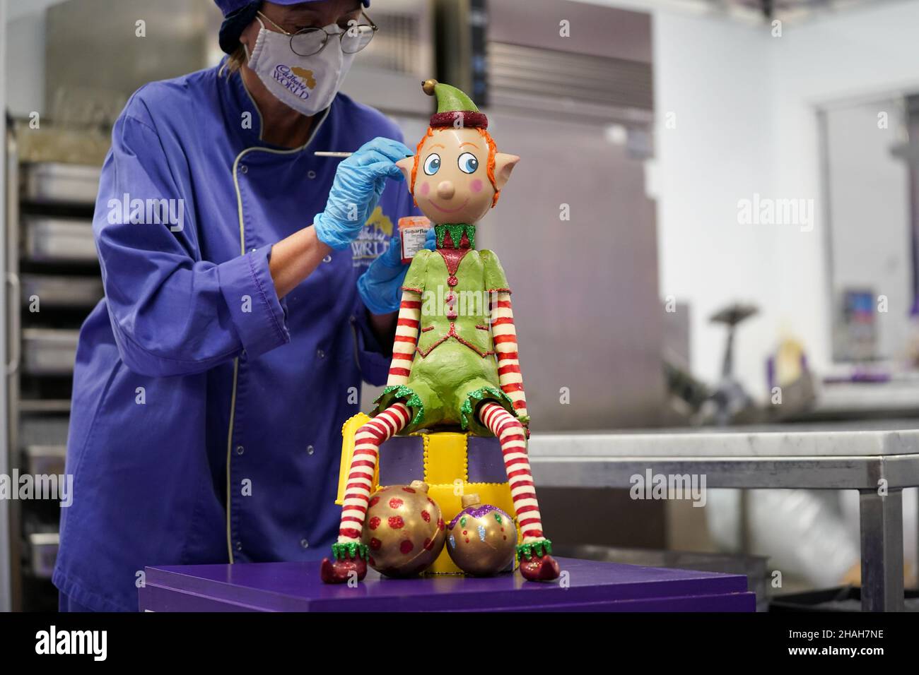 Chocolatier Dawn Jenks adds the finishing touches to the Christmas elf ...