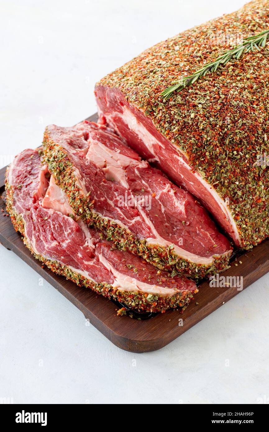 spicy fresh beef ribeye on white wooden background. Close up meat Stock ...