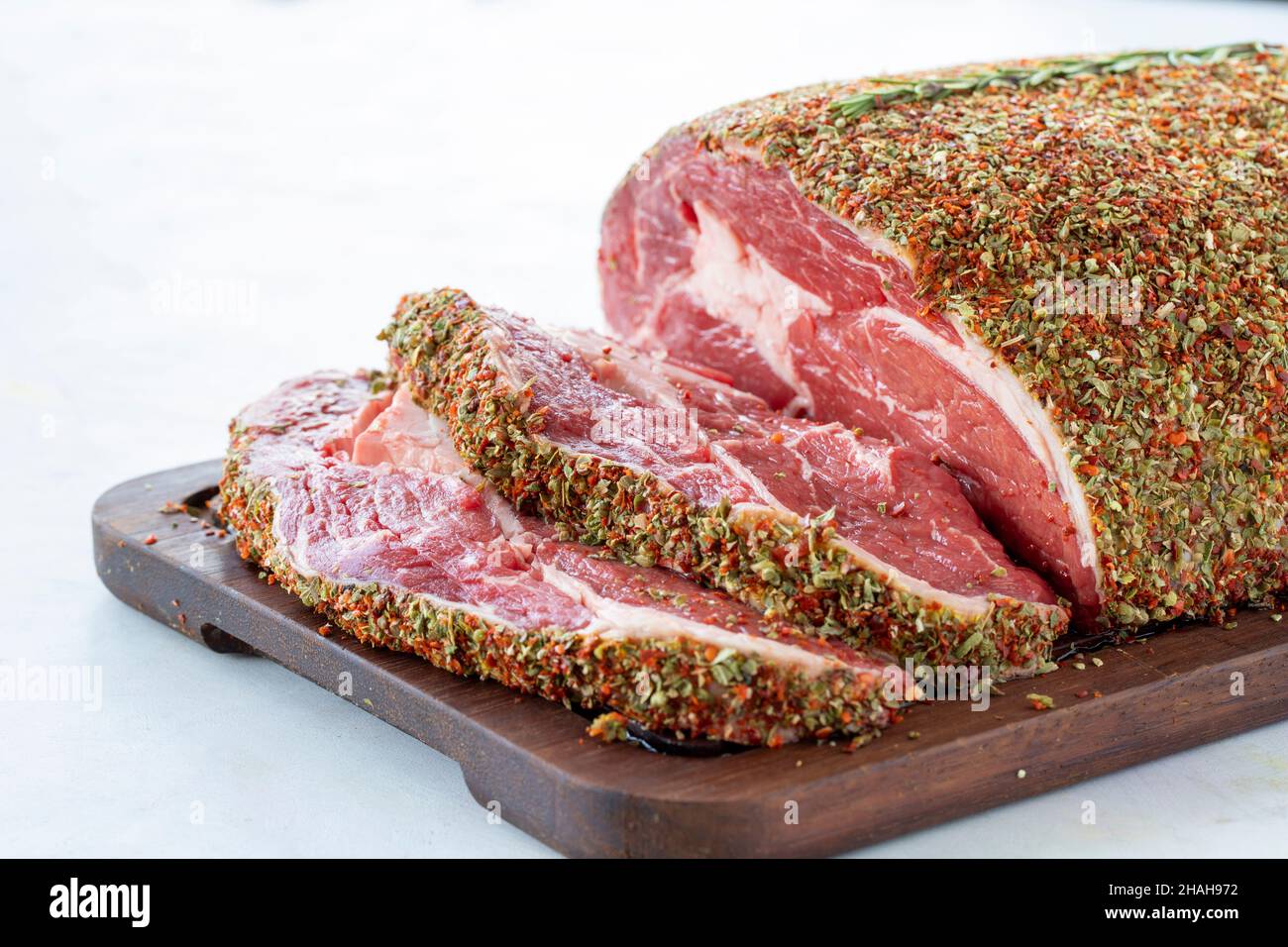 spicy fresh beef ribeye on white wooden background. Close up meat Stock ...