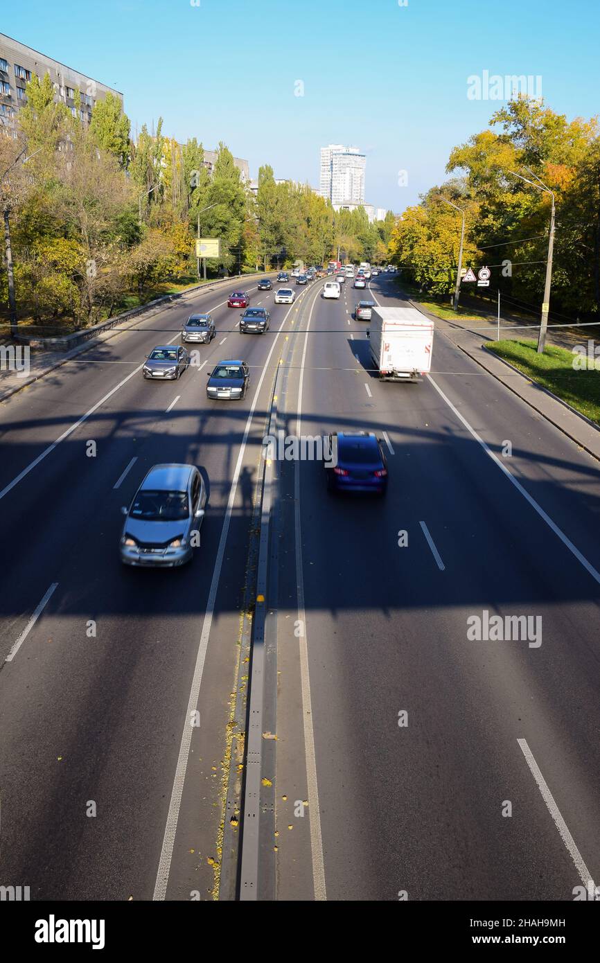 Many cars are photographed from above from a high angle. Cars travel in ...