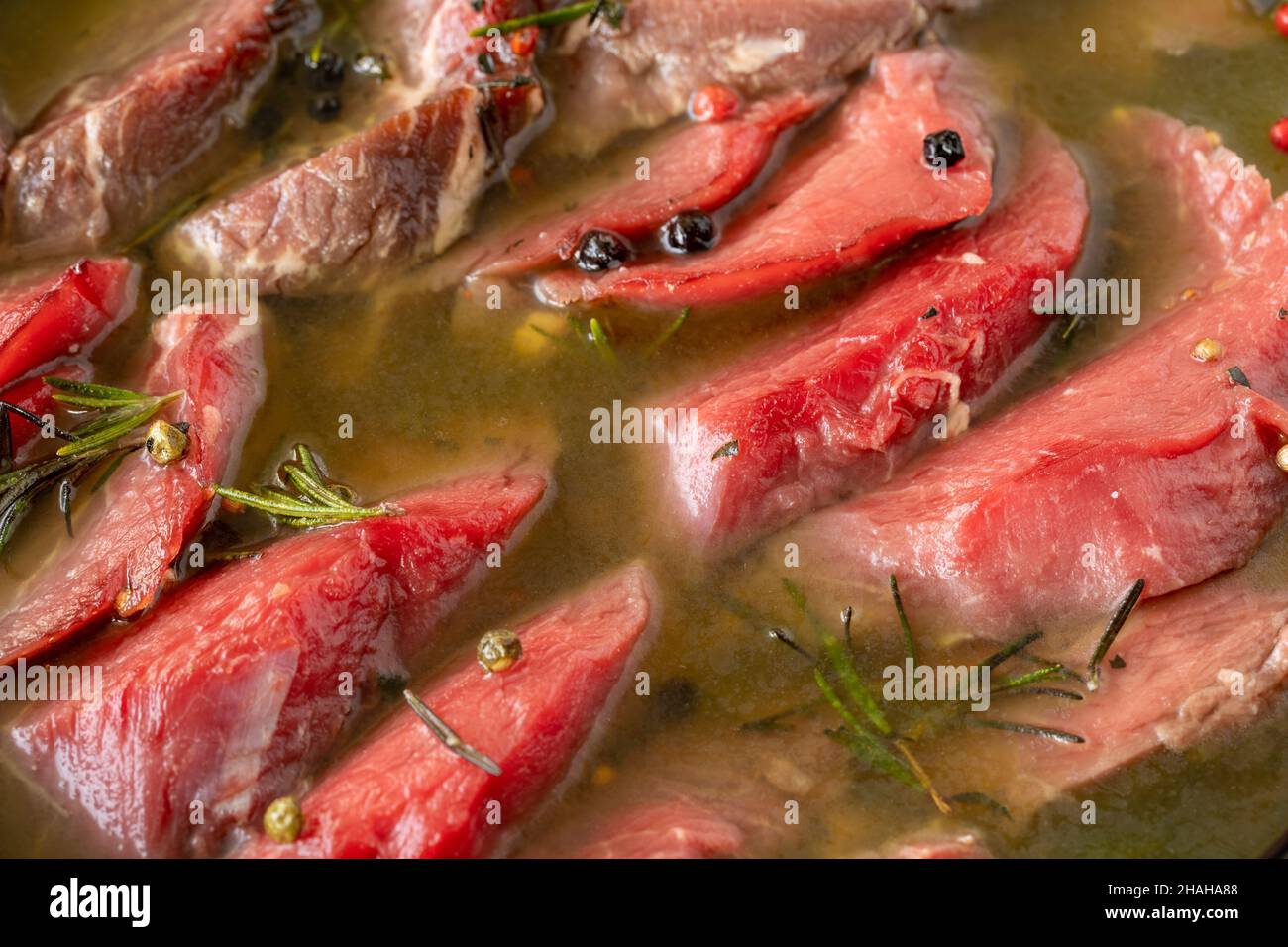 Marinated boneless beef on a white wooden background. Meat background ...