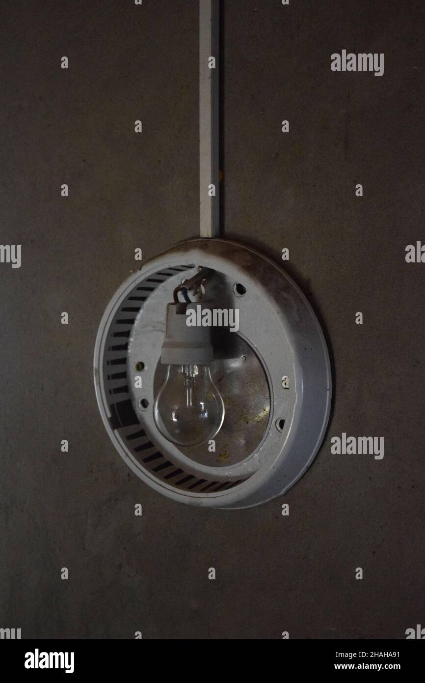 A switched off lamp of a lamp of a round shape without a plafond ...