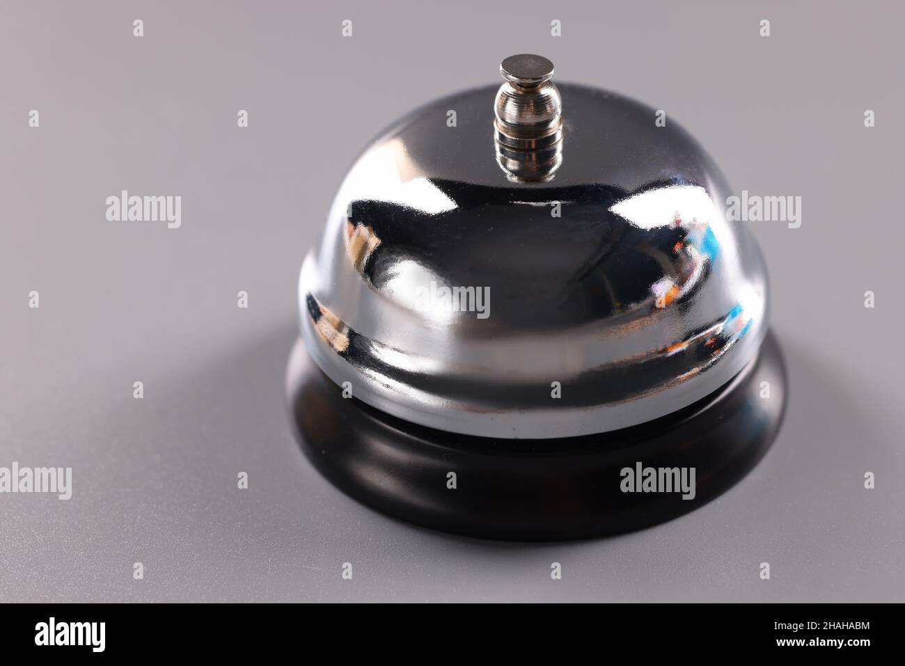 Silver vintage ringing bell on gray background Stock Photo - Alamy
