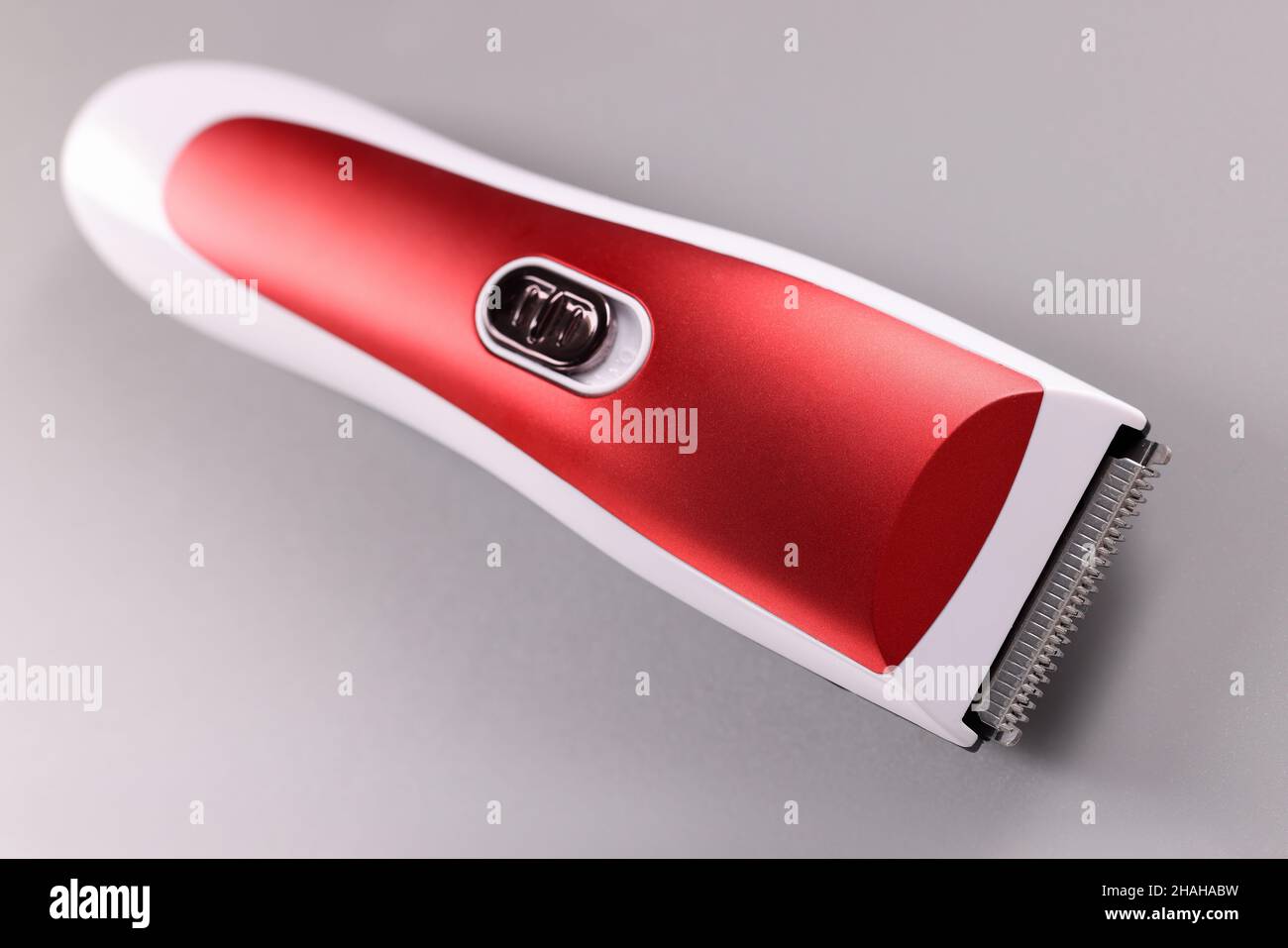 Electric razor for cutting hair on gray background Stock Photo - Alamy