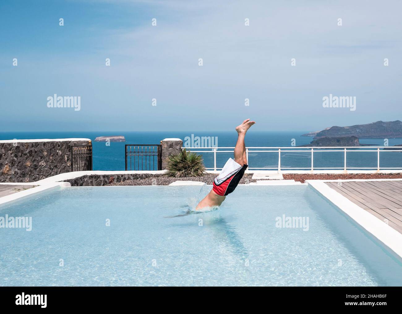 Man diving into a swimming pool Stock Photo - Alamy