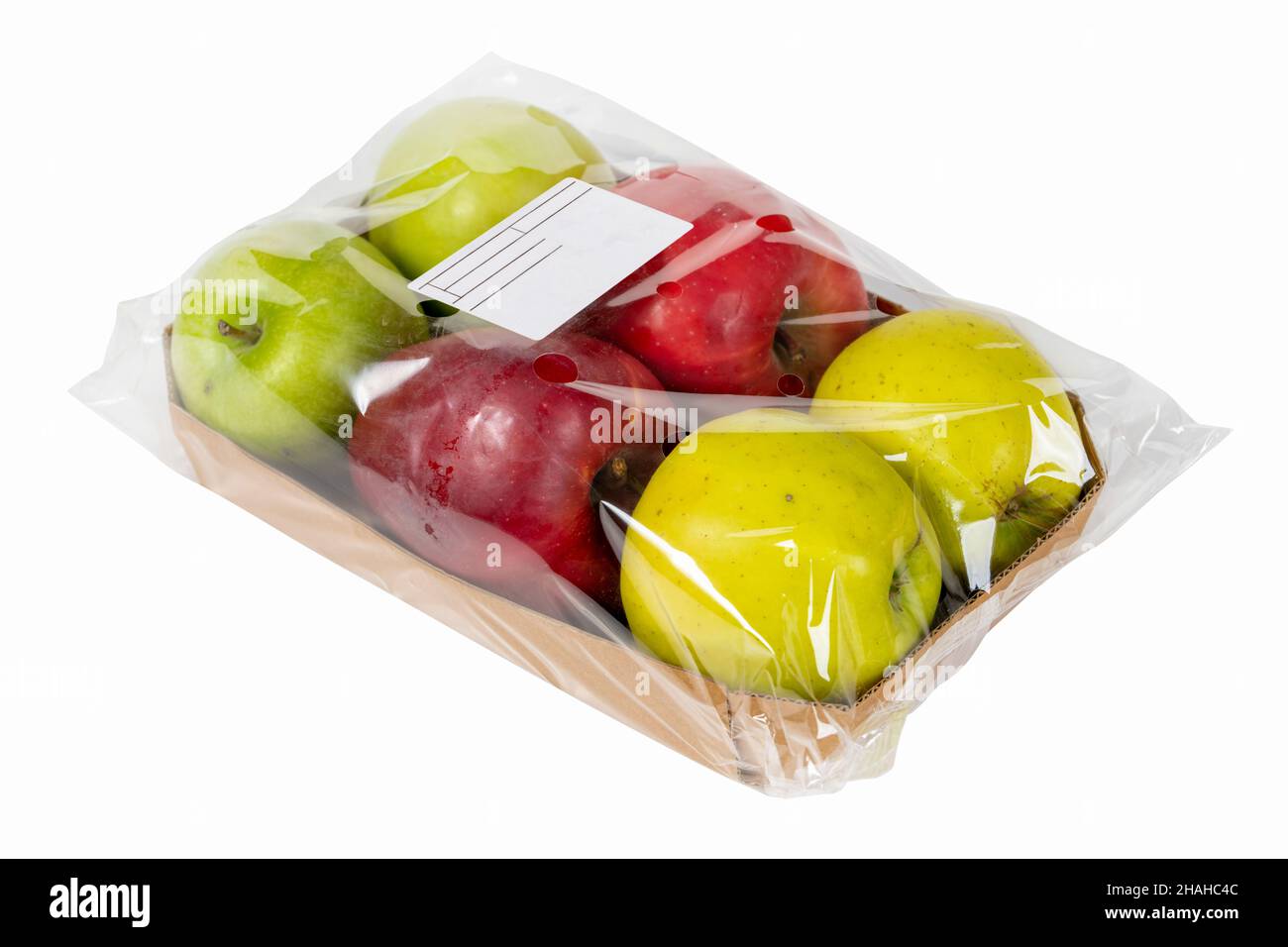 Labeled and packaged yellow, green and red apple on white background ...