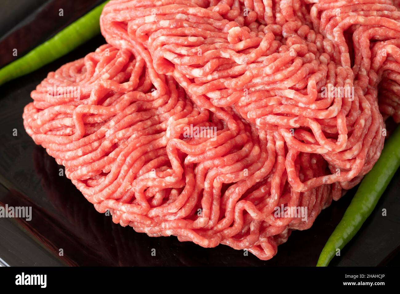Raw Ground beef on white wooden background. Minced Meat background ...