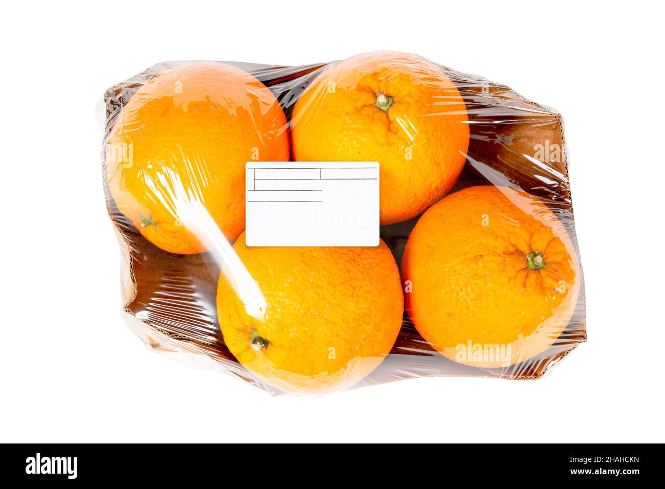 Labeled and packaged fresh oranges on white background Stock Photo - Alamy