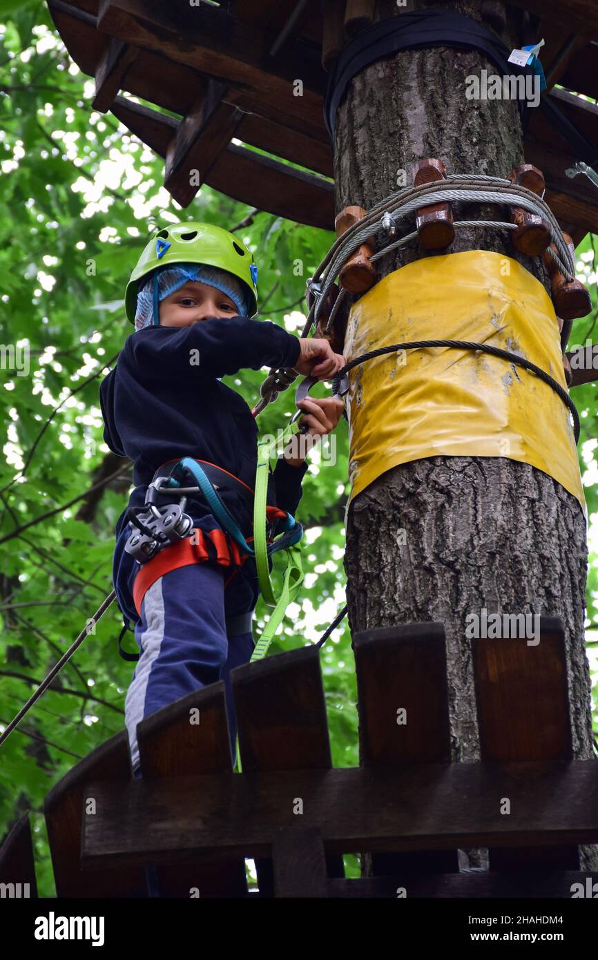 Teen boy climbing tree hi-res stock photography and images - Alamy