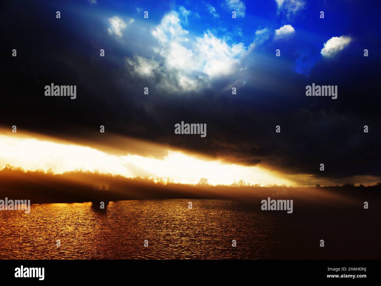 Awesome light rays on sunset river background Stock Photo - Alamy