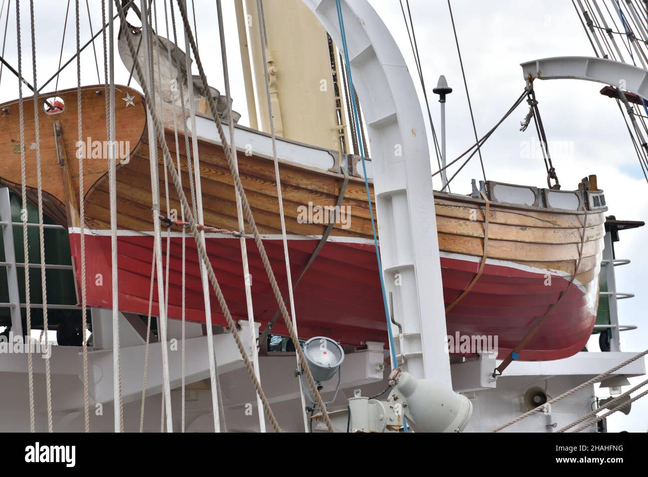 an ancient wooden lifeboat on a great sailing ship Stock Photo - Alamy