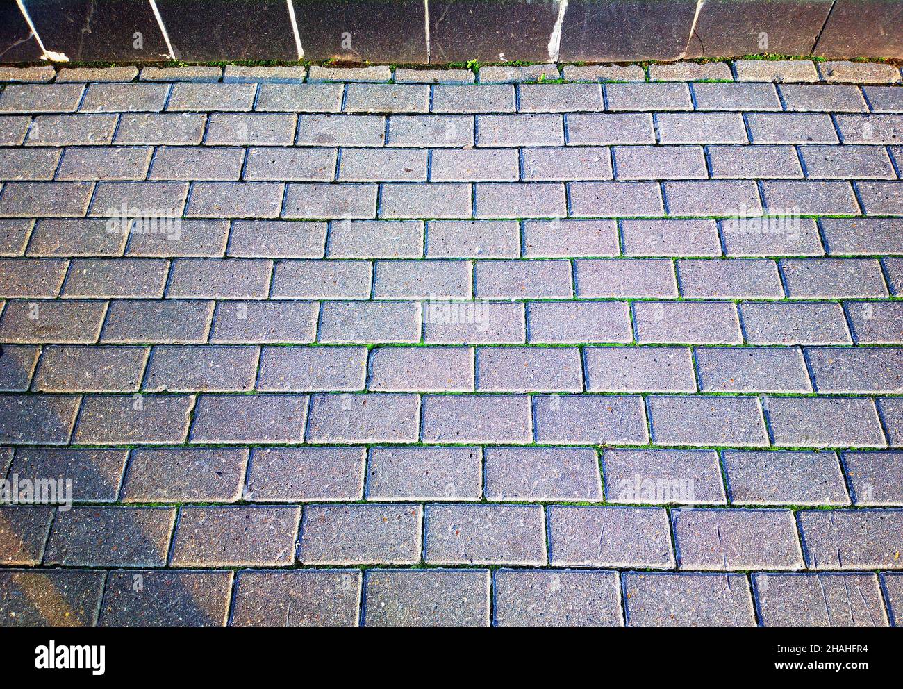 Symmetric pavement tile texture background Stock Photo - Alamy