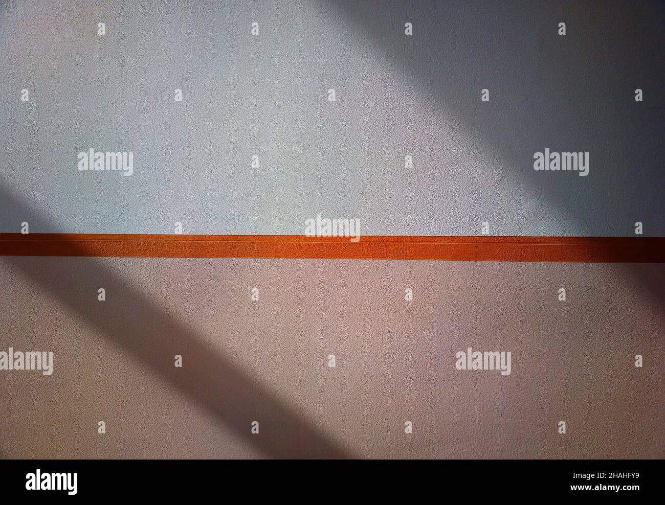Horizontal orange line on wall texture Stock Photo - Alamy