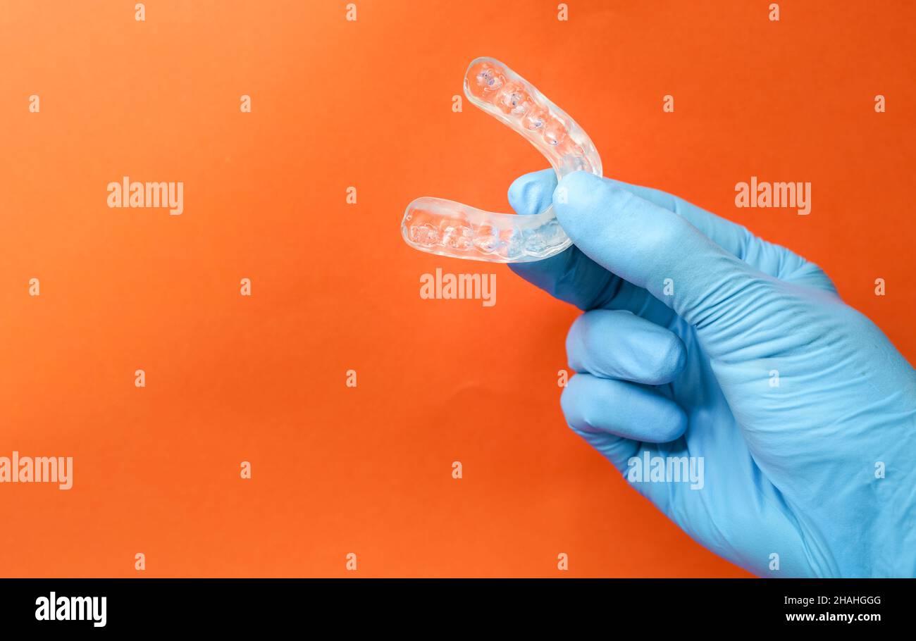 doctor holding a dental retainer or dental splint Stock Photo - Alamy
