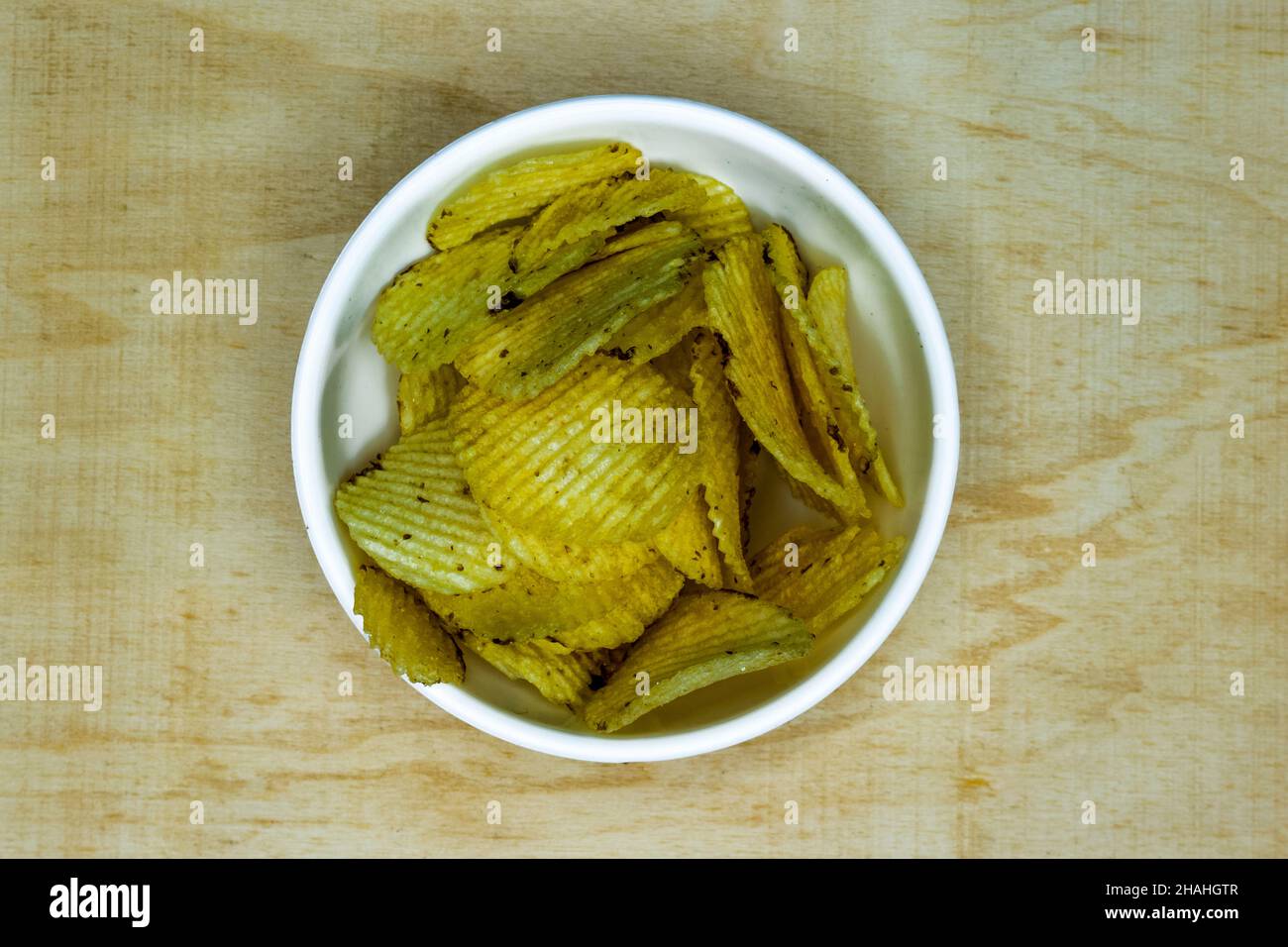 Salted Potato Wafers in Big White Bowl on Wooden Table, Heap of Wafers ...