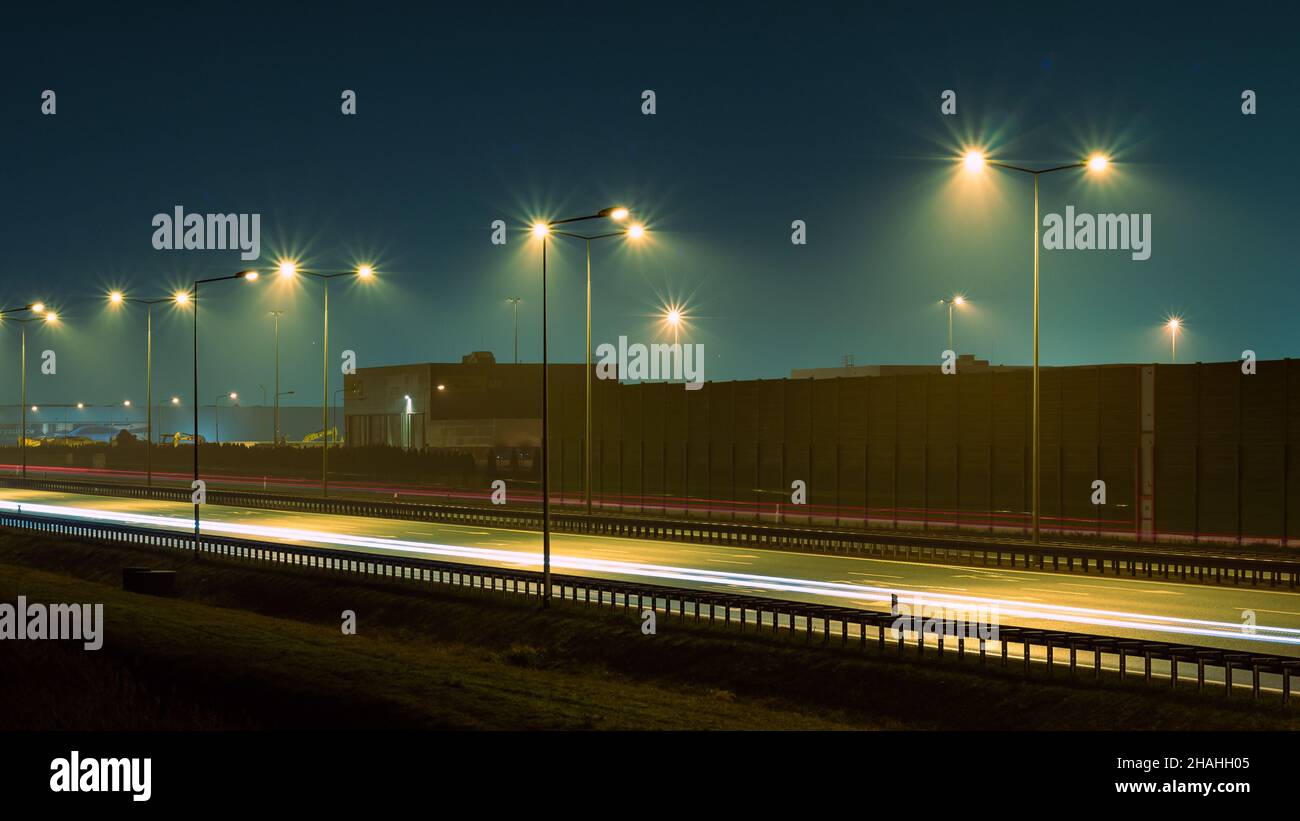 Lightened motorway at night Stock Photo - Alamy