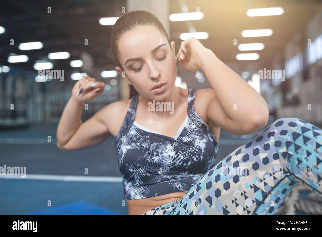 Young woman exercises in gym healthy lifestyle abs workout Stock Photo ...
