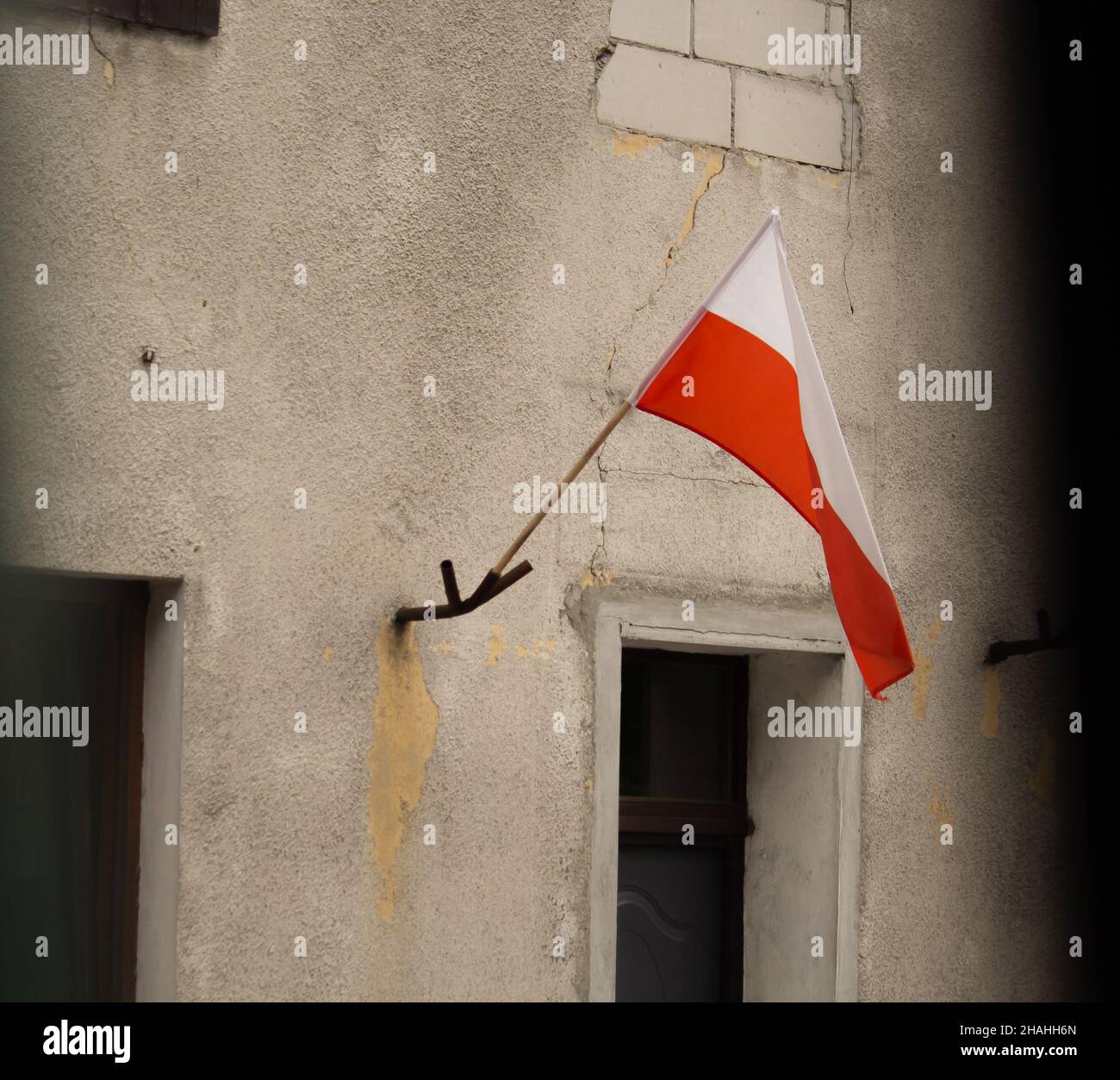 Polish national flag waving against the stone wall Stock Photo - Alamy
