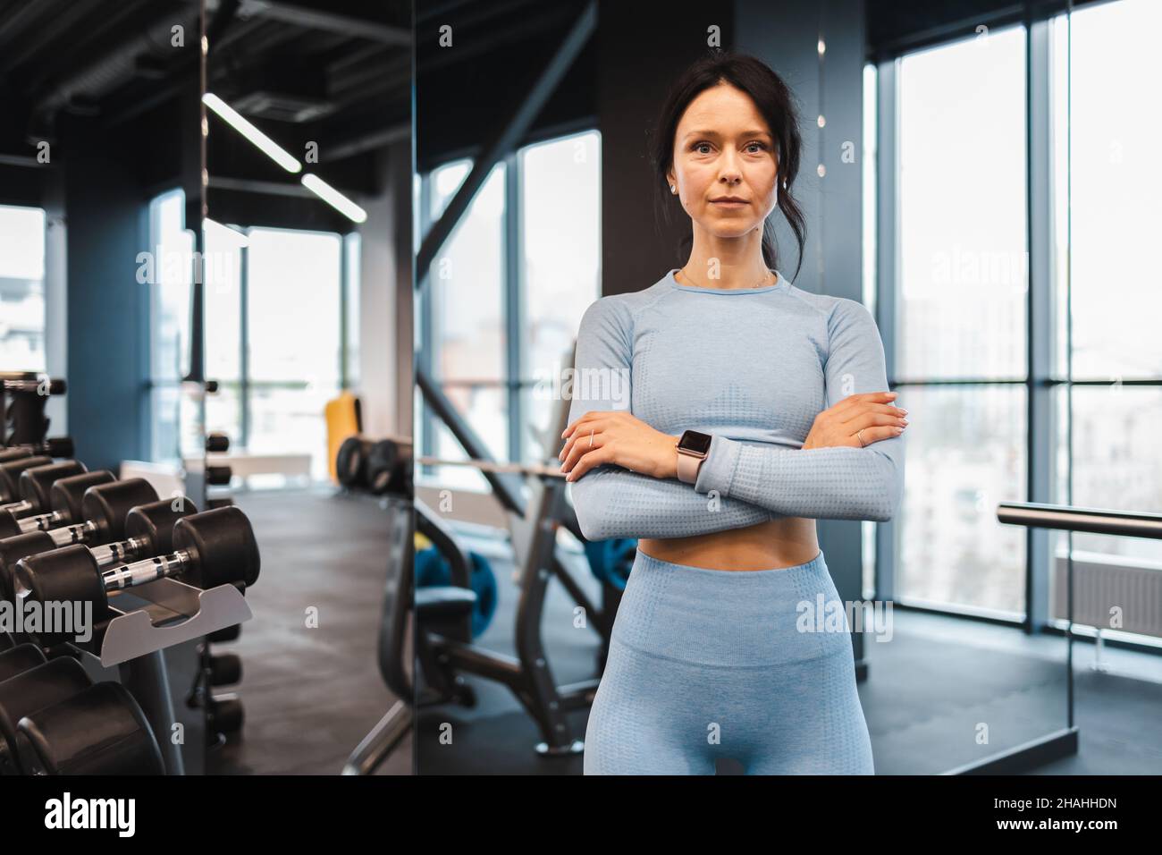 Portrait of female fitness trainer in the gym Stock Photo - Alamy