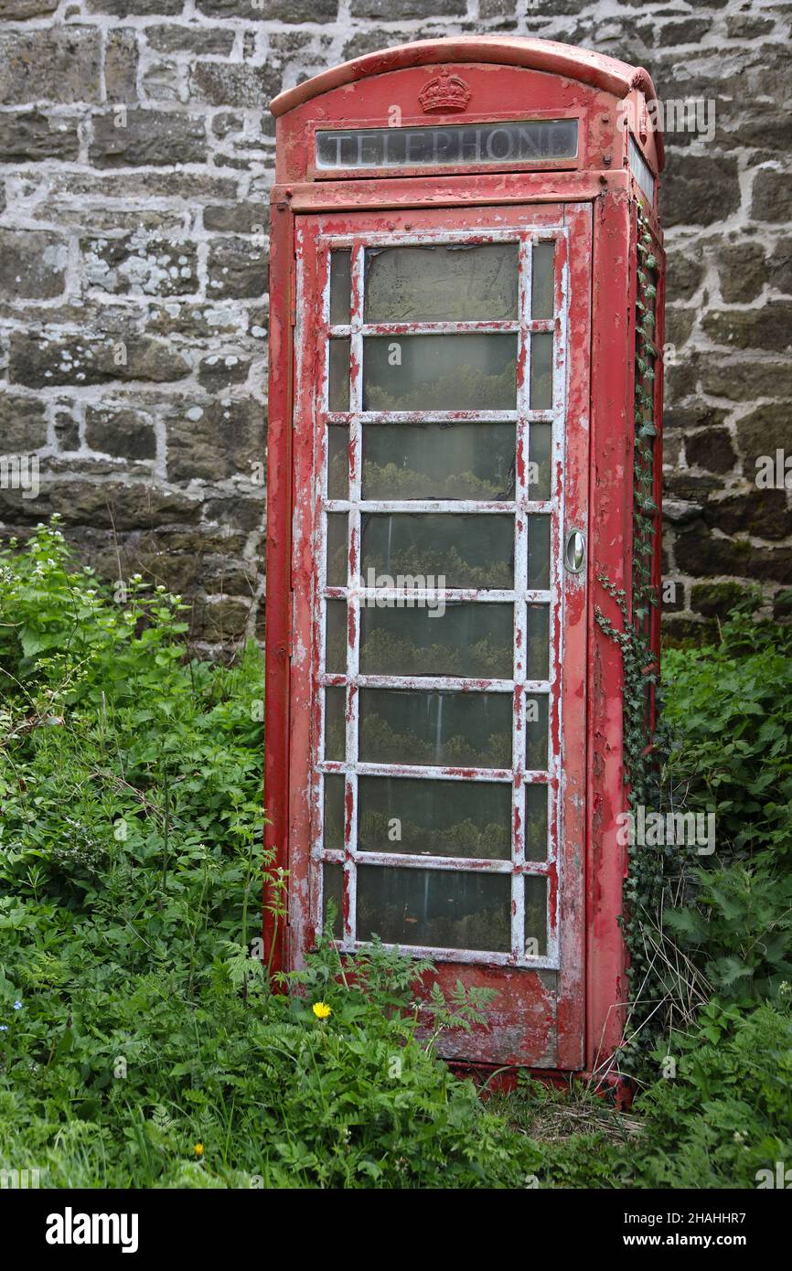Old telephone box rotting Stock Photo - Alamy