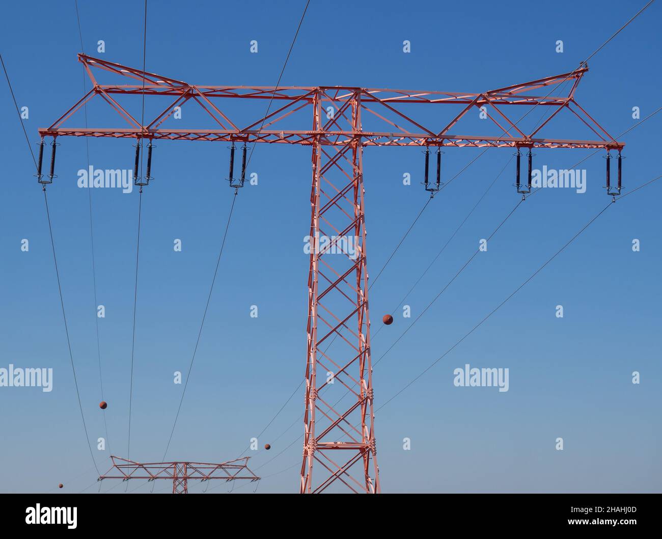 red power pole with blue background Stock Photo - Alamy
