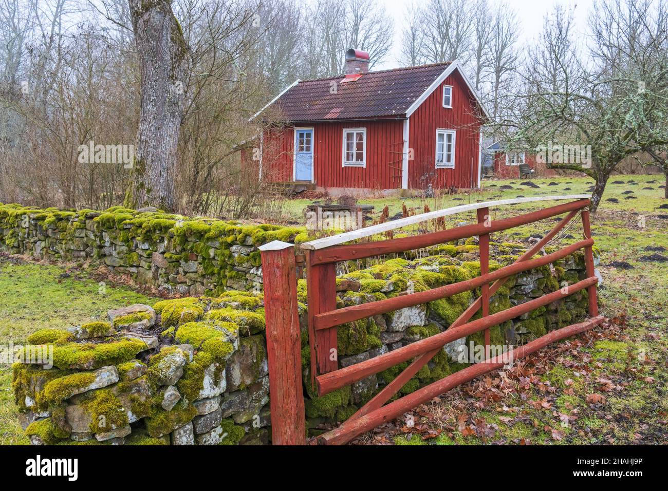 Gate to a red cottage in the country Stock Photo - Alamy