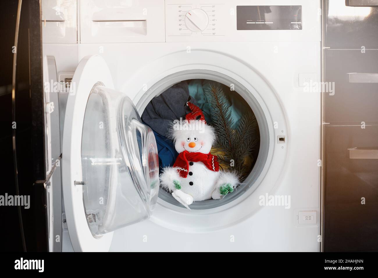 Snowman in the washing machine. Christmas Stock Photo - Alamy