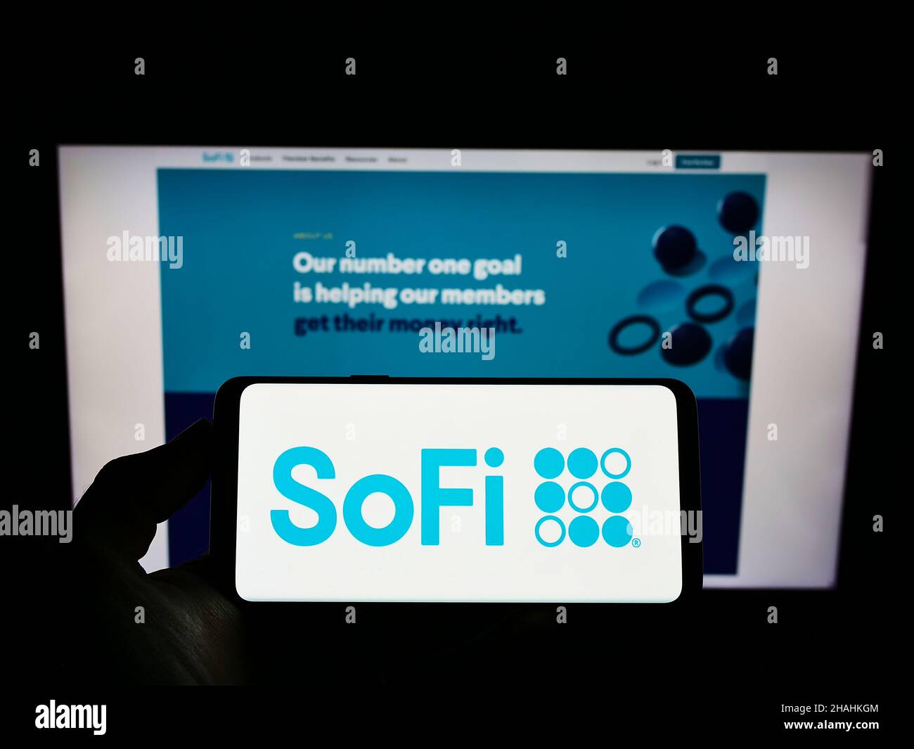 Person holding cellphone with logo of American financial company Social ...