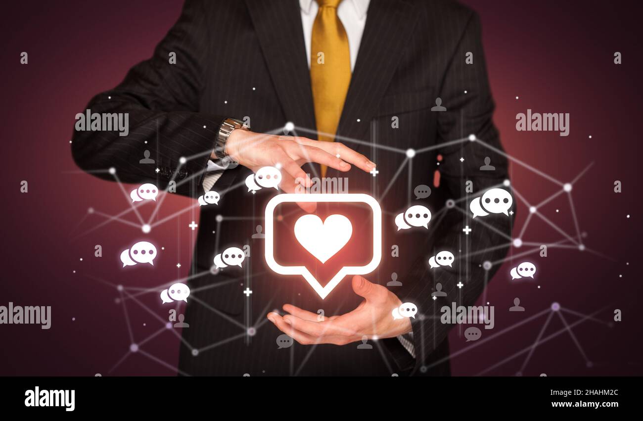 Hand holding social media icons Stock Photo - Alamy