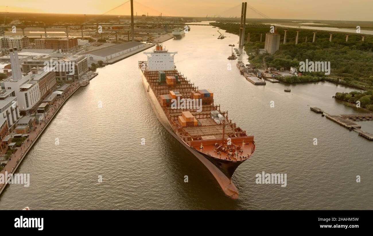 Aerial view of a mostly empty container ship leaving the port of ...
