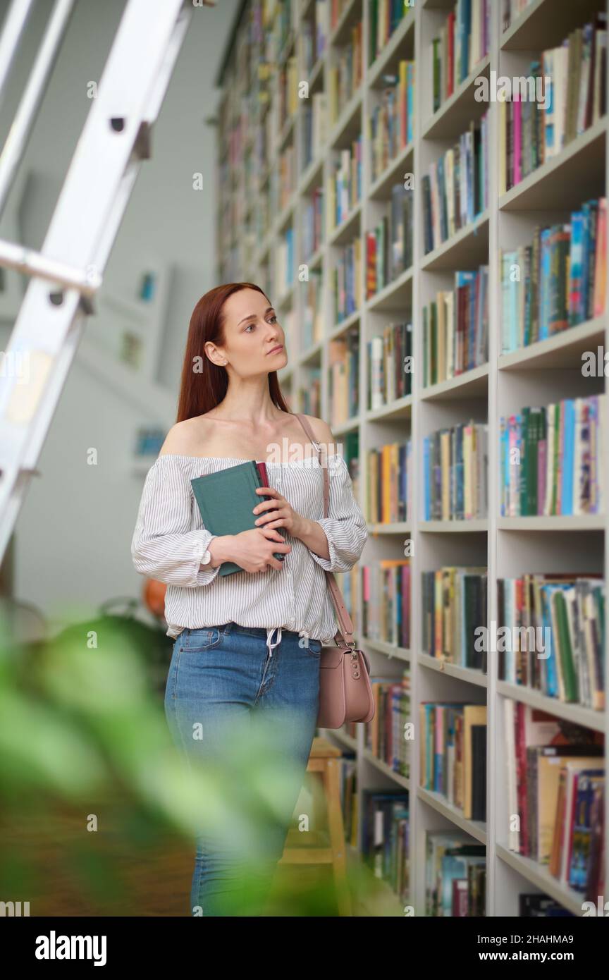 Positive woman choosing interesting hi-res stock photography and images ...