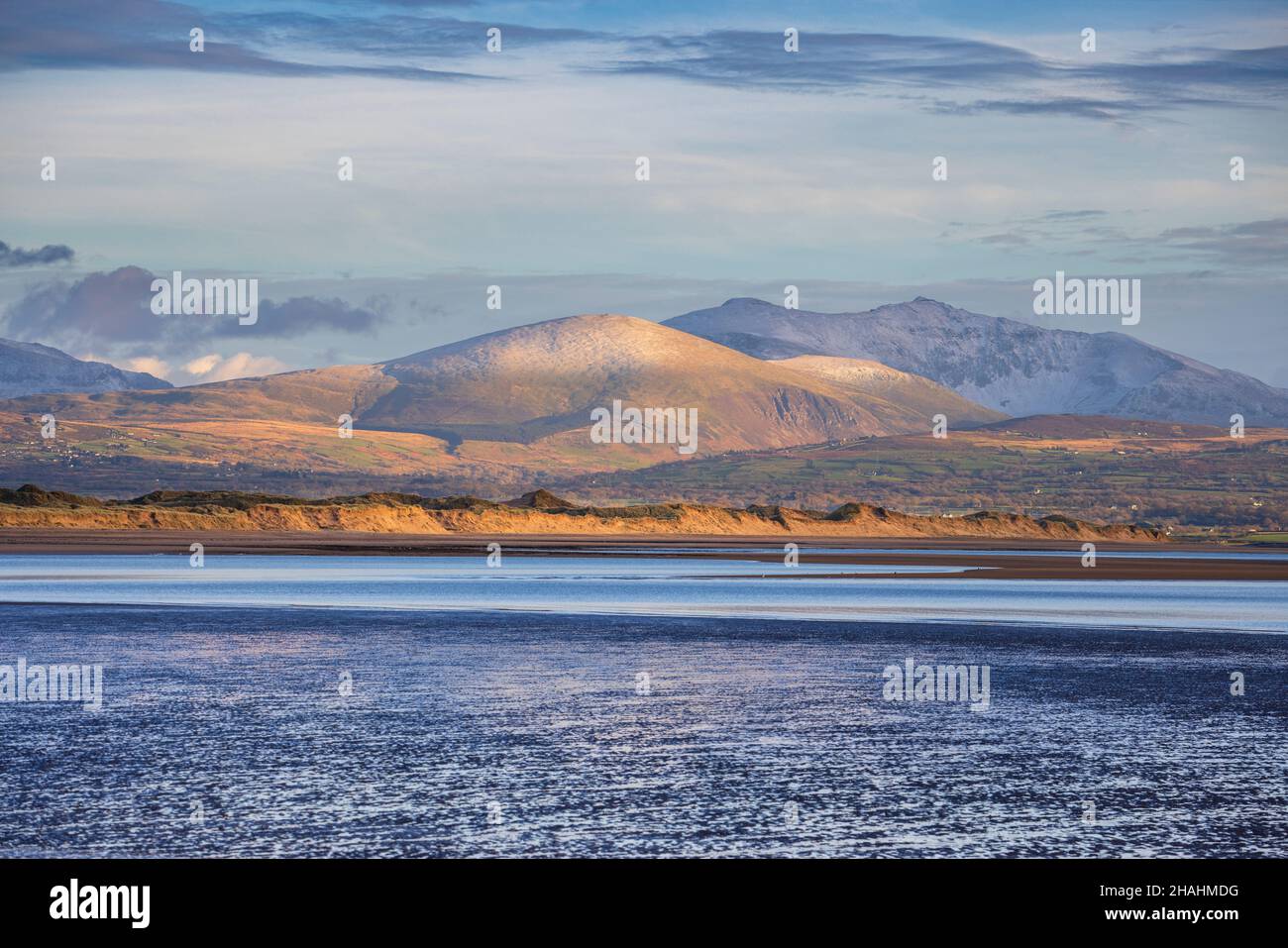 Mount Snowdon and the Snowdonia mountains from Newborough Beach in the ...
