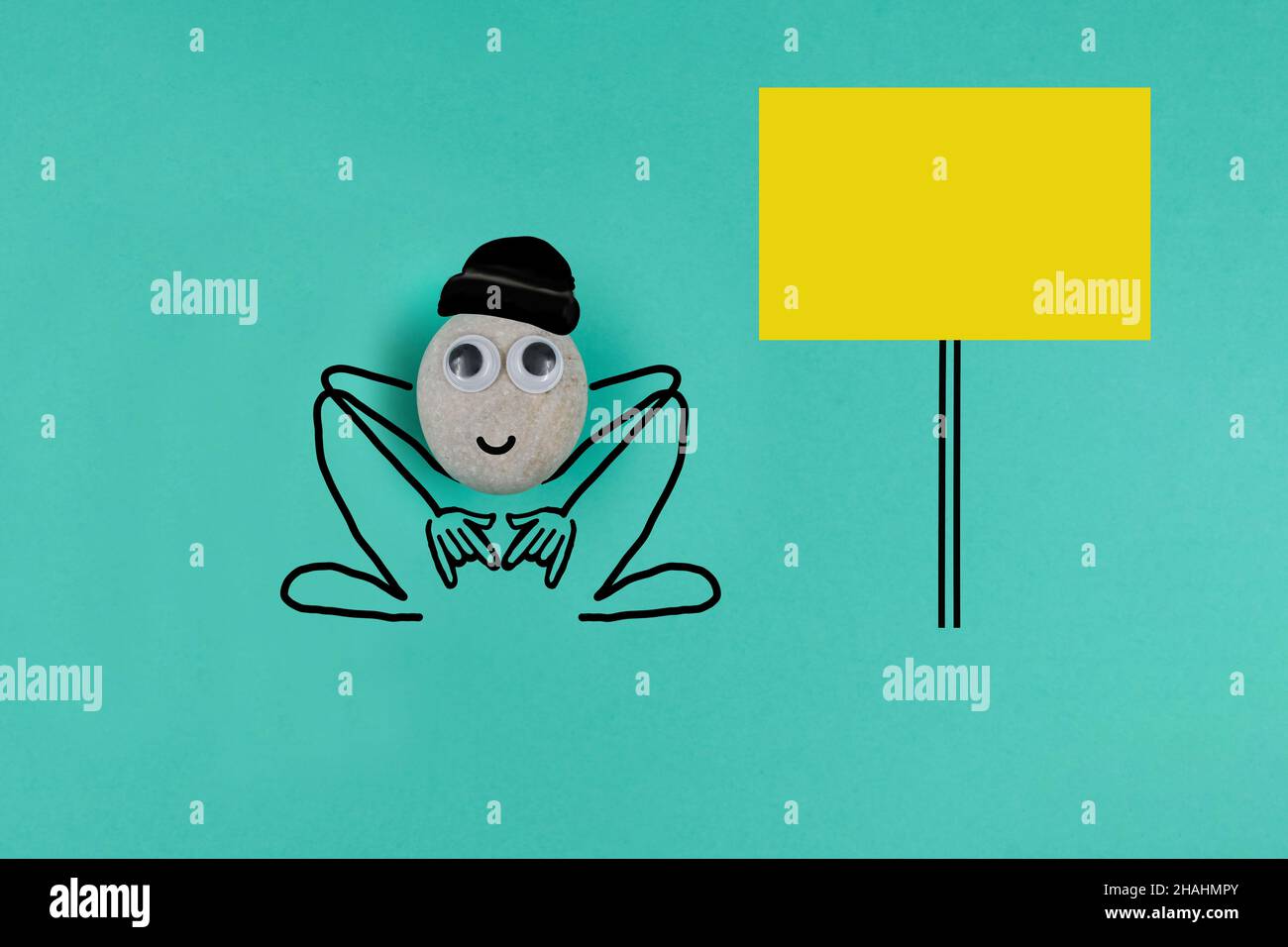 Animated pebble in a black wool cap squatting down, with big memo on ...