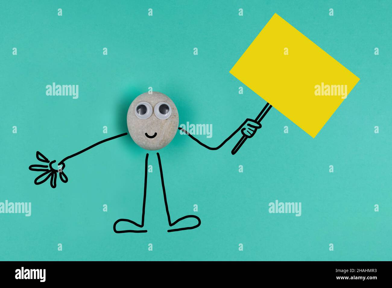 Animated pebble with a happy face holds big memo on blue paper ...