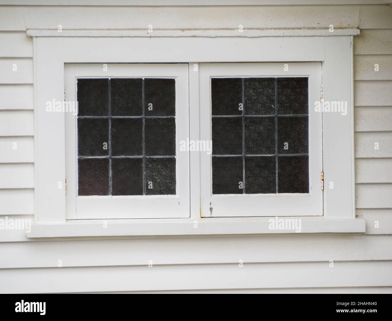 small divided white wooden window with privacy glass Stock Photo - Alamy