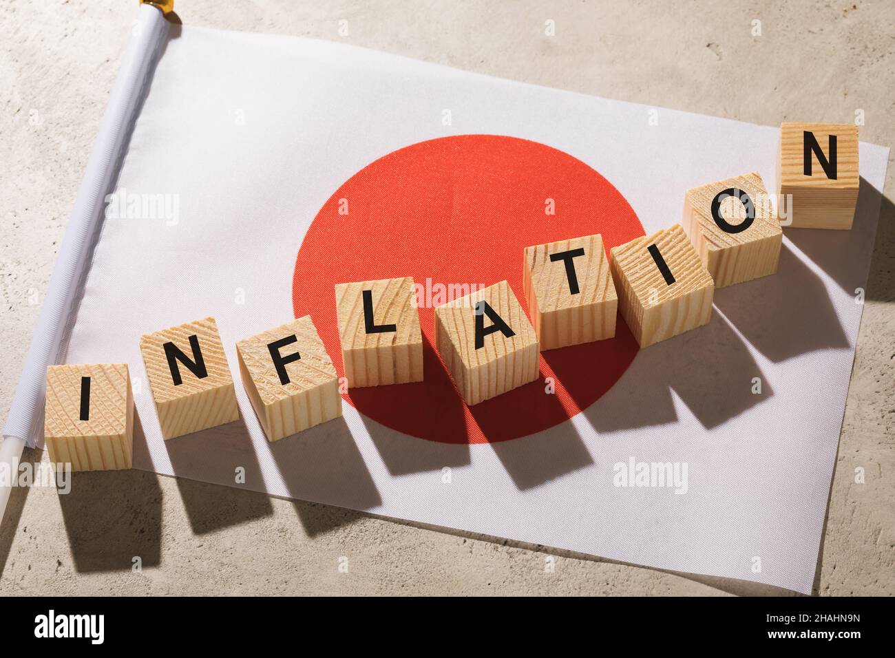 Japanese flag and wooden cubes with text, concept on the theme of ...