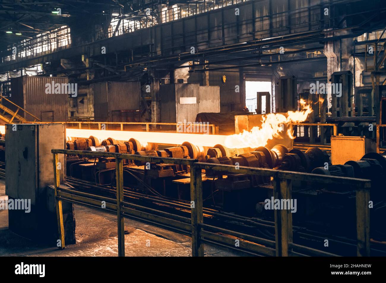 Steel pipe just after furnace ready for next step of production. Iron ...