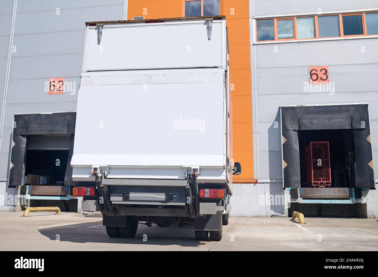Truck waiting for loading near warehouse Stock Photo - Alamy