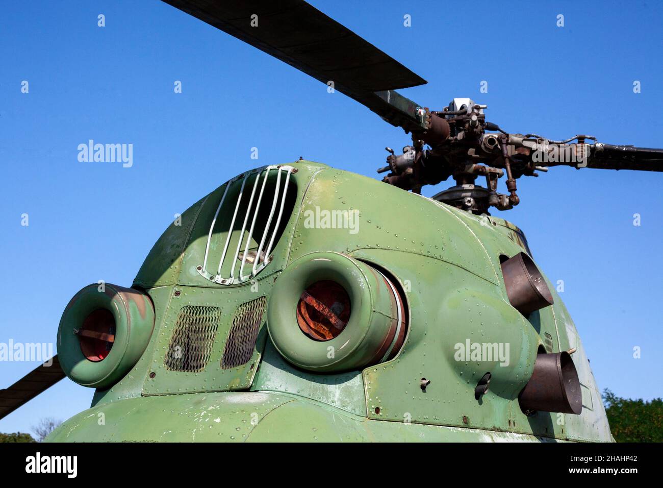 Detail of engine cover housing and rotors of an old military helicopter ...