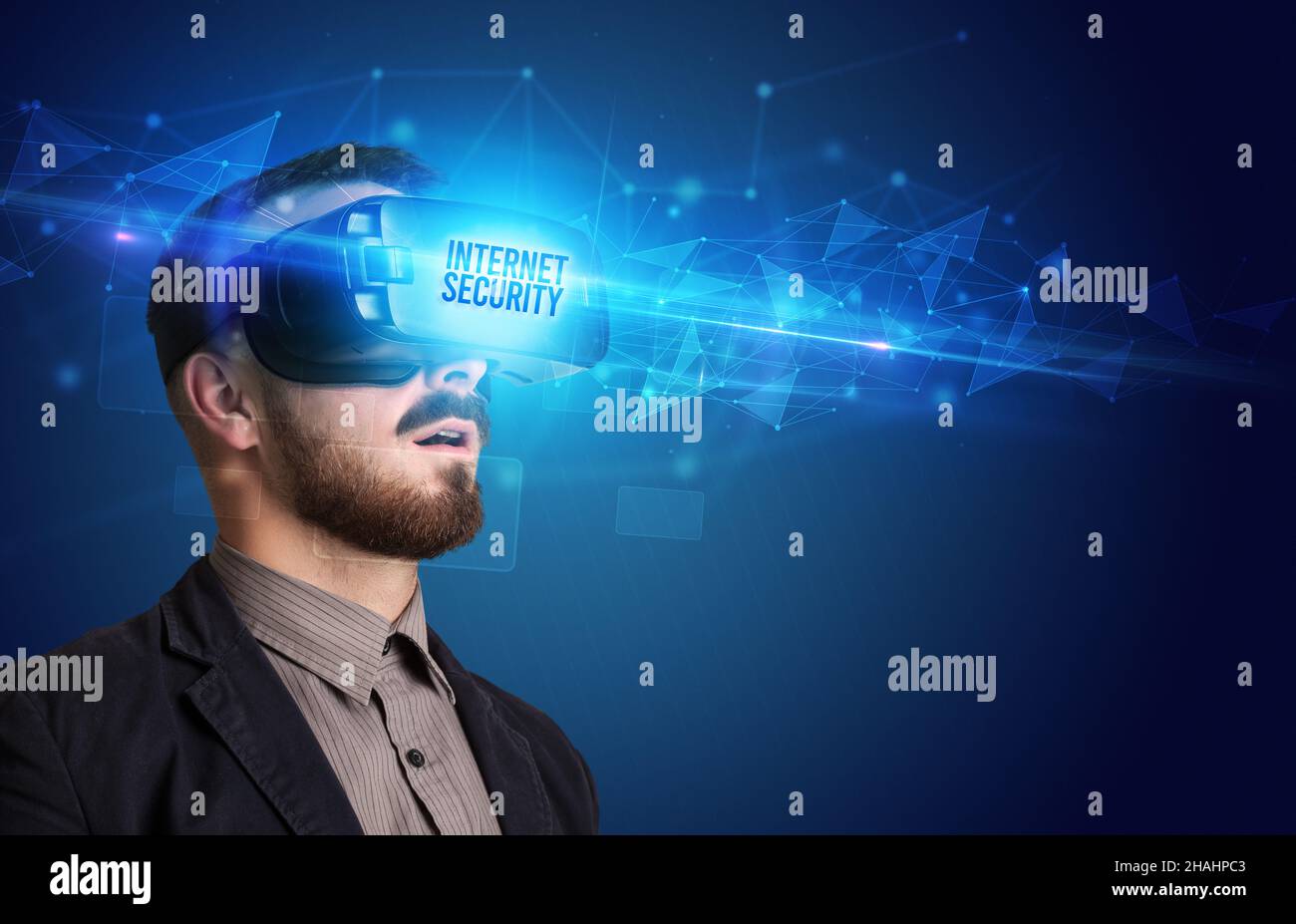 Businessman looking through Virtual Reality glasses, virtual security ...