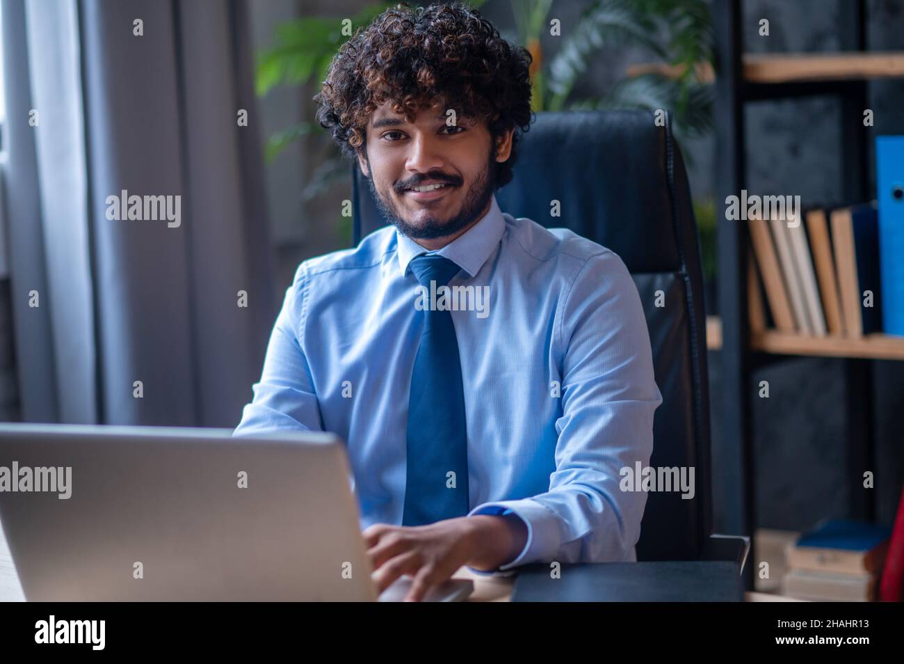 Bearded man laptop smiling camera hi-res stock photography and images ...