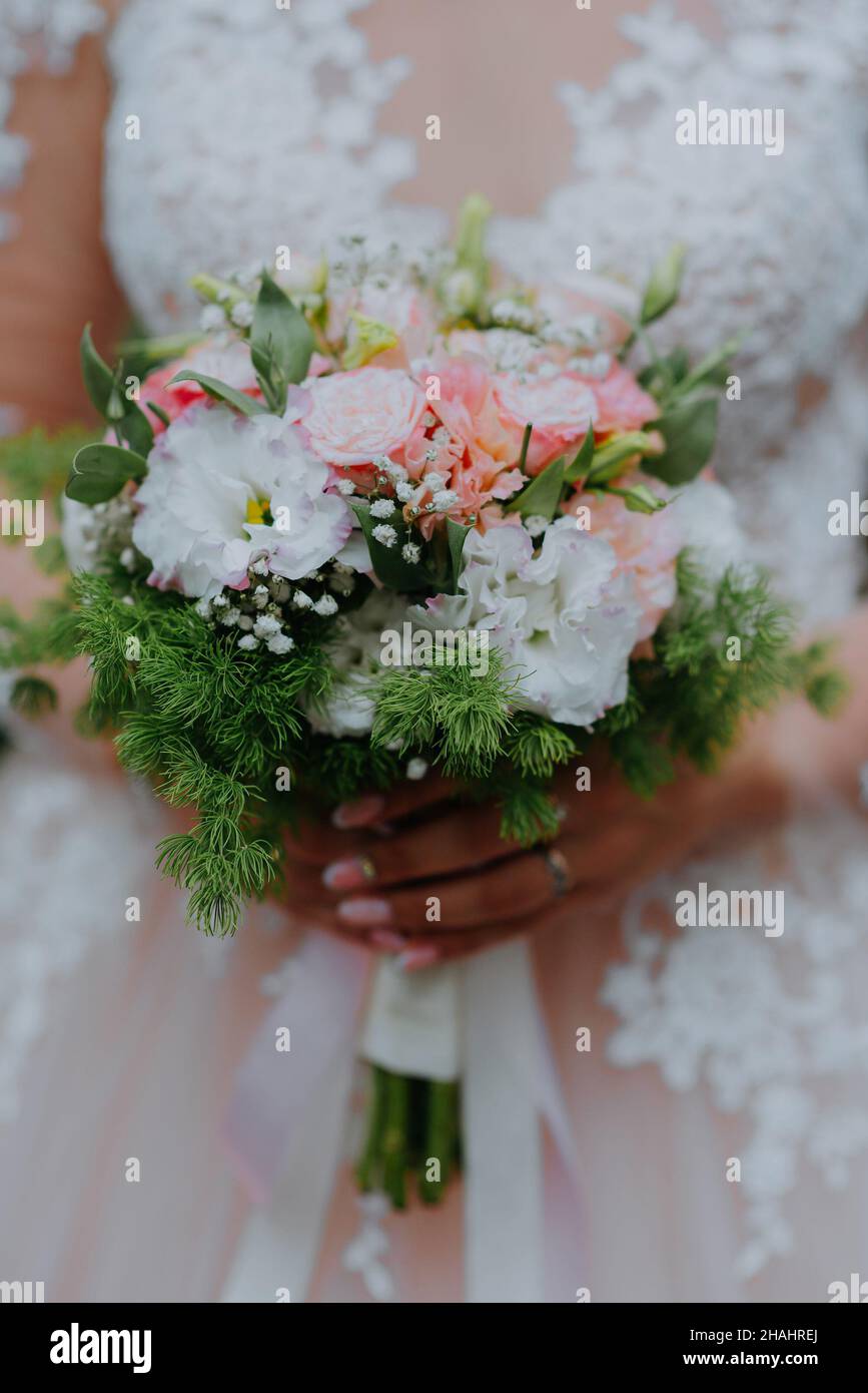 Beautiful wedding bouquet of flowers in hands of the bride. Bridal ...