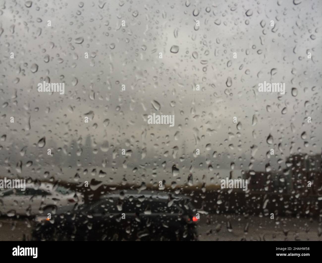 HIghway traffic seen through a car window with raindrops Stock Photo ...