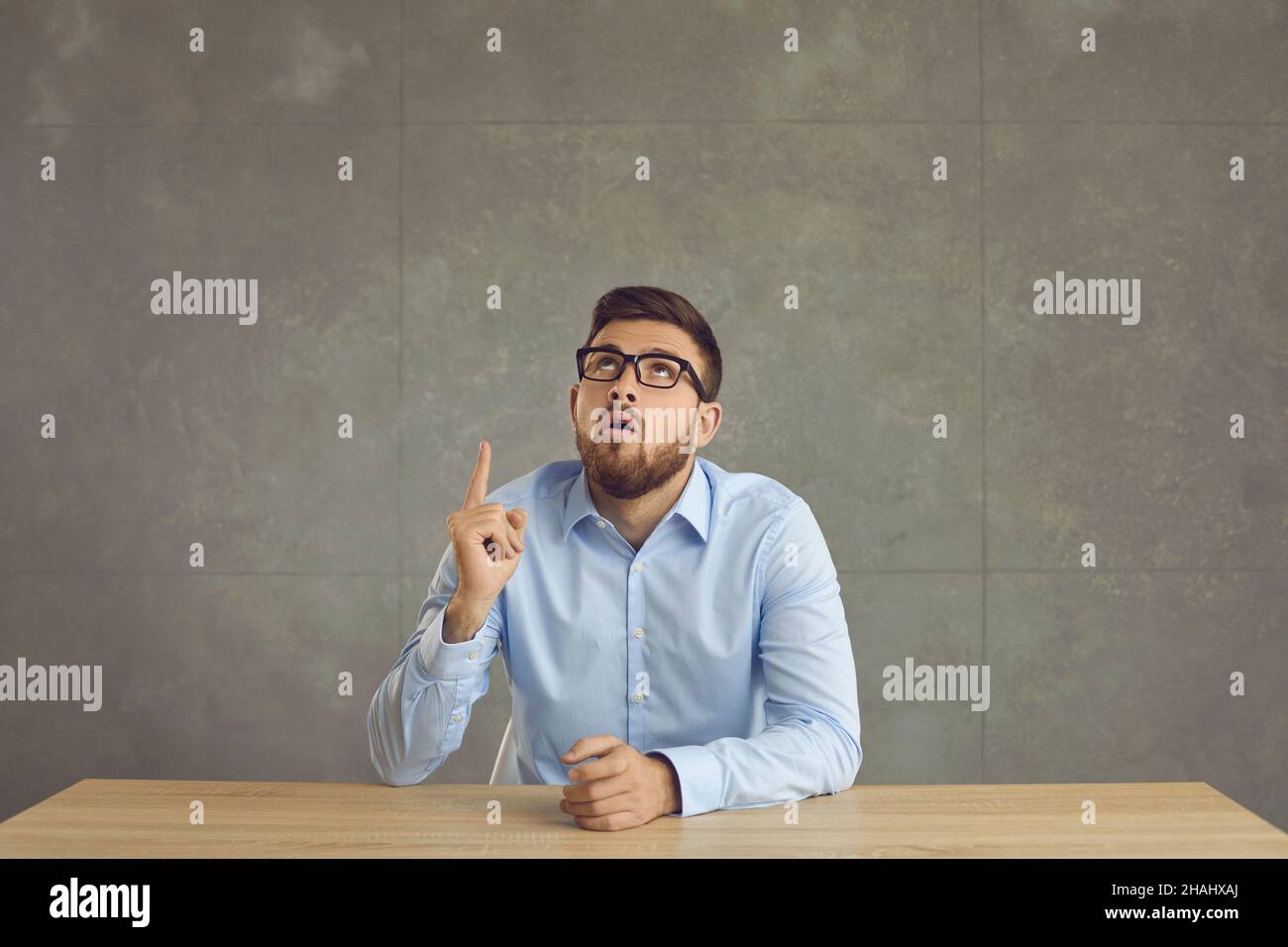 Portrait of a funny young and smart man who came up with a great ...