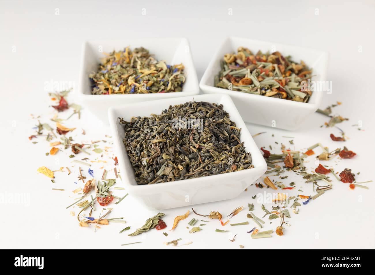 Concept of cooking tea with different types of tea on white background ...