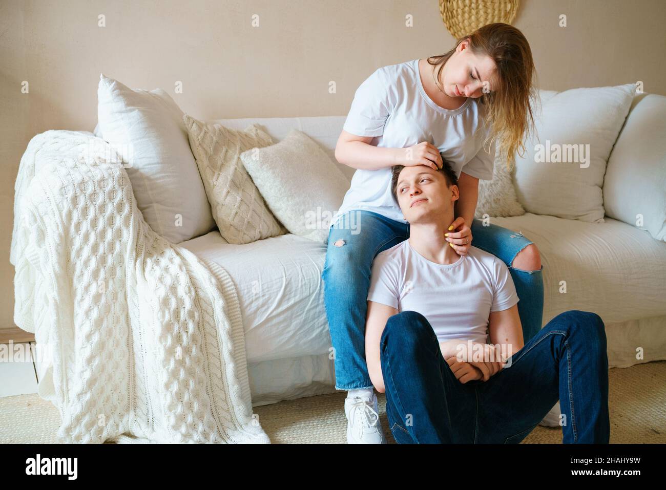 Portrait of an emotional young couple hugging each other, guy and girl ...