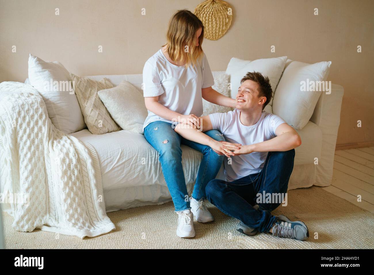 Portrait of an emotional young couple hugging each other, guy and girl ...